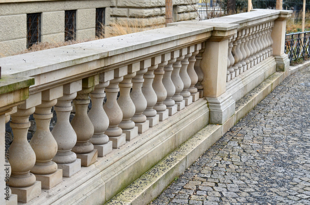 beige stone railing of a historic building balustrade reminiscent of a ...