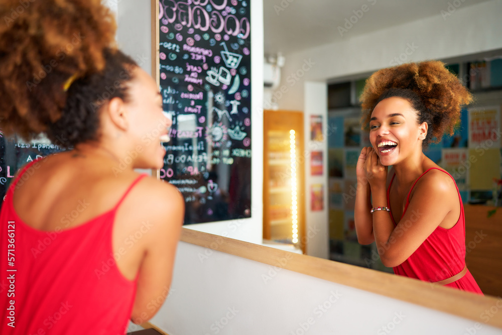 beautiful young black brazilian afro woman fixing herself in the mirror ...