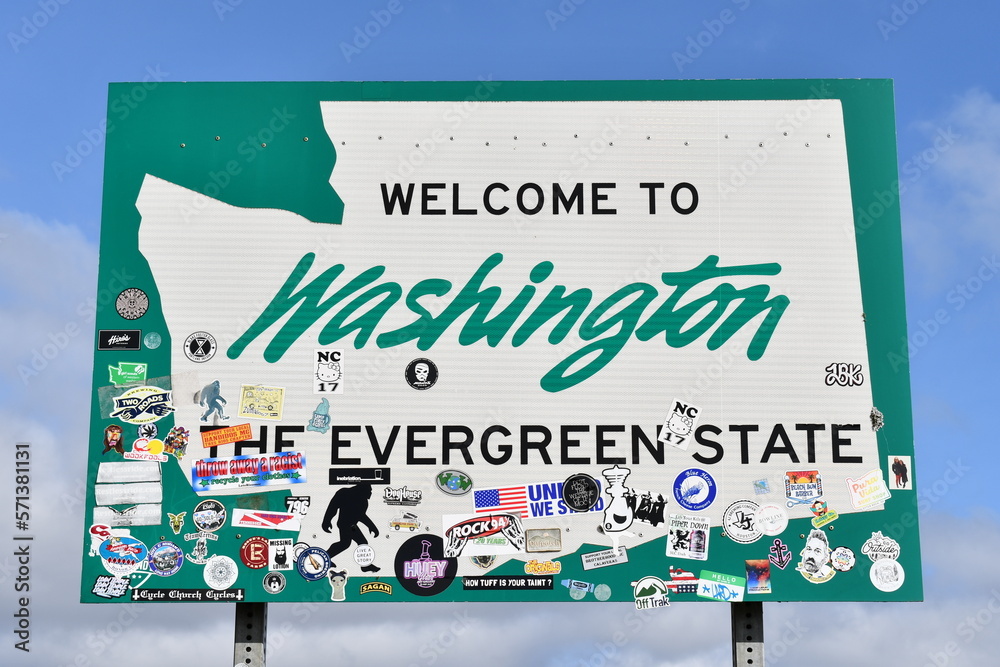 Welcome to Washington State sign, covered in stickers. Stock Photo ...