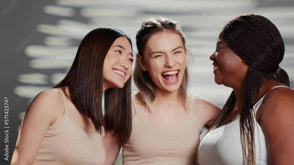 Multiethnic group of models posing for body positivity ad in studio ...