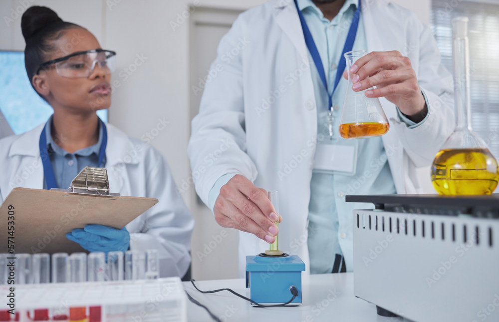 Science, laboratory and team with liquid in test tube for medical ...