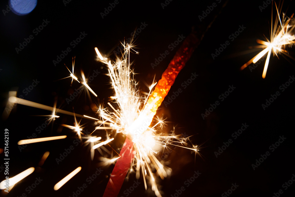 narrow depth of field Lightening sparkler on the black background ...