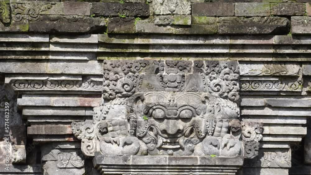 The relief of kala kirtimukha on penataran temple. Kala kīrttimukha is ...