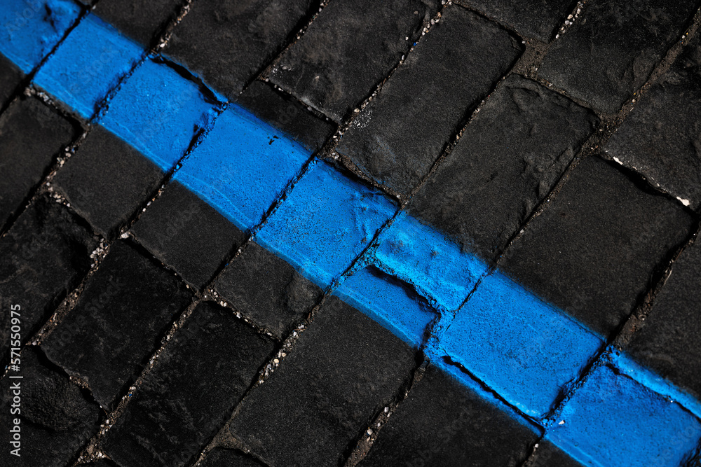 Road markings on the paving stones. The old road in the city. Historic ...