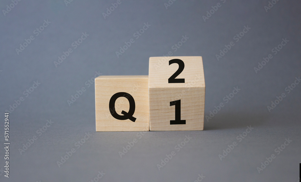 From 1st Quarter to 2nd symbol. Turned wooden cubes with words 1st ...