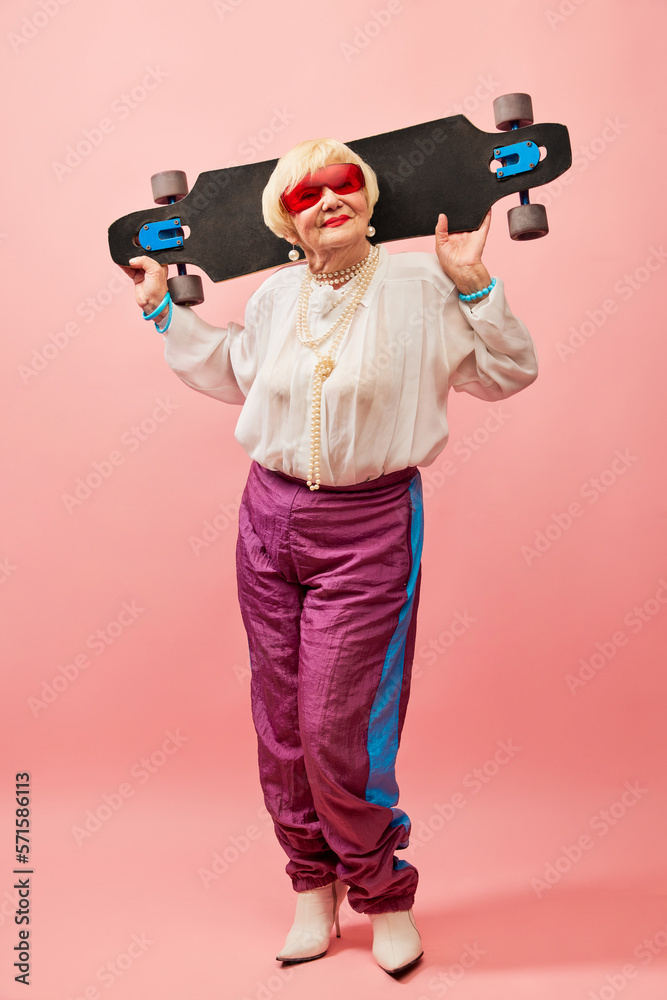 Energetic lady. Beautiful old woman, grandmother in stylish clothes ...