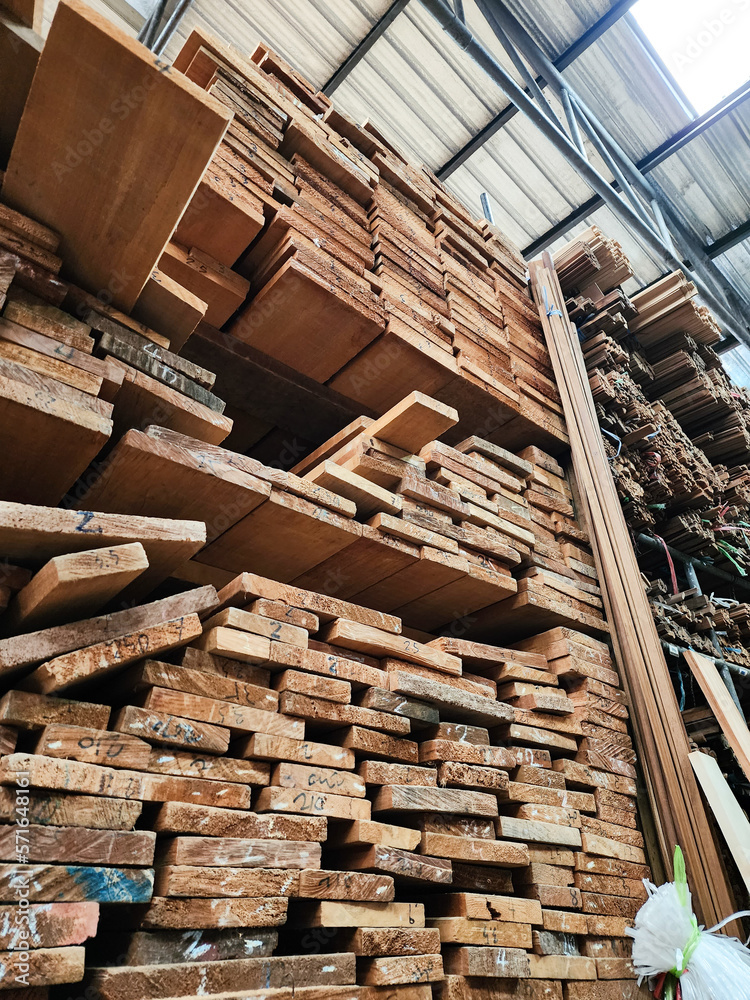 Teak wood,teak wood stump in the sawmill on low light indoor,Piles of ...