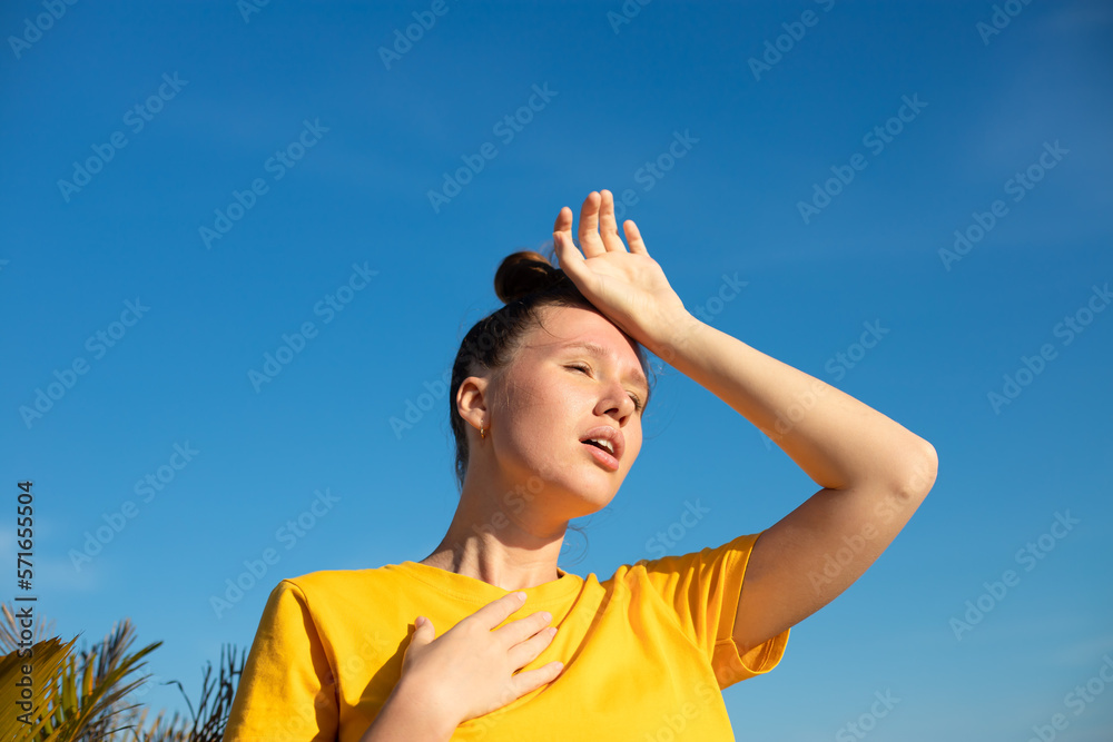 Girl is suffering from heat, woman with heatstroke. Having sunstroke at ...
