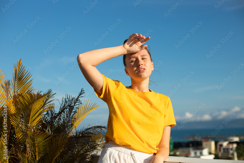 Girl is suffering from heat, woman with heatstroke. Having sunstroke at ...