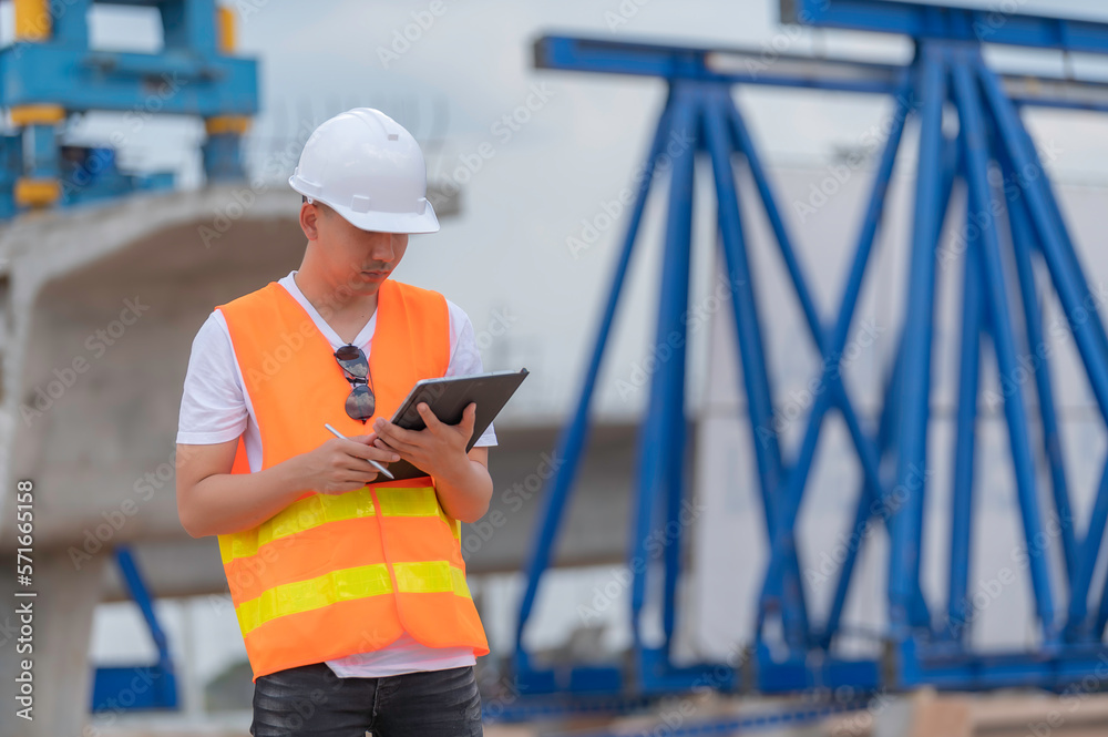 Group of asian engineers discuss about work at site of building under ...