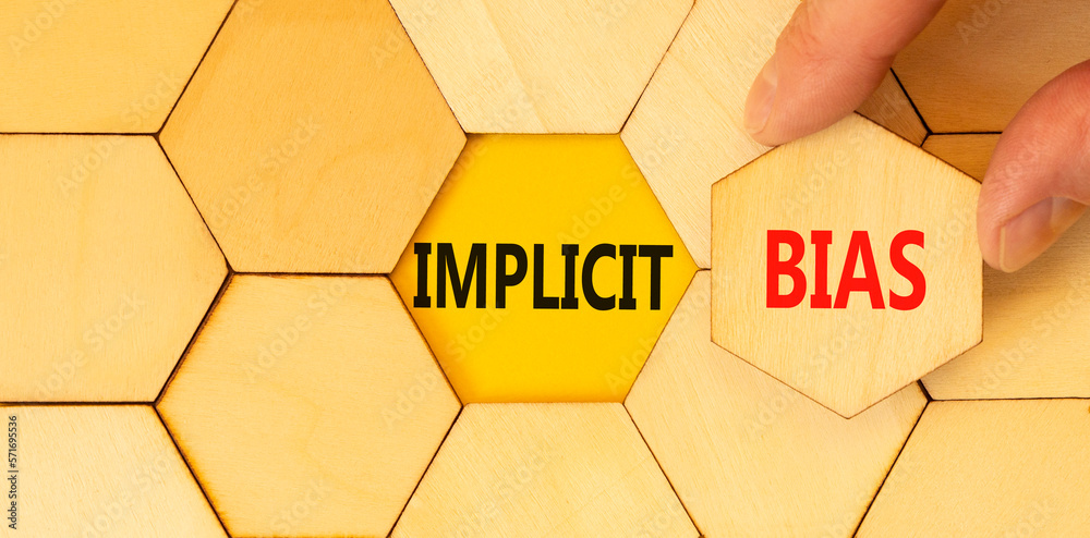 Implicit bias symbol. Concept words Implicit bias on wooden puzzles ...
