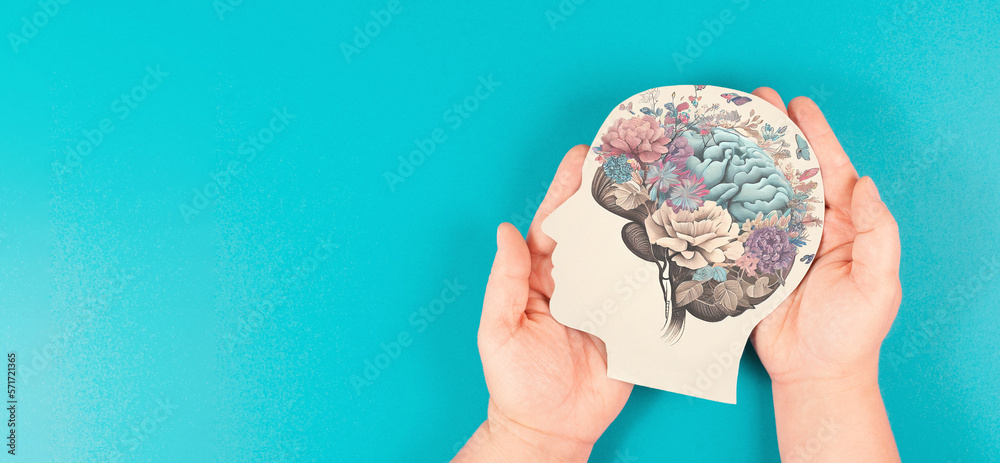 Hands holding paper head, human brain with flowers, self care and ...