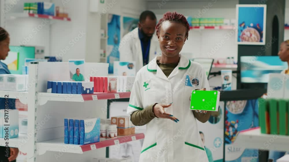 Health specialist pointing at medicine box with greenscreen, howing ...