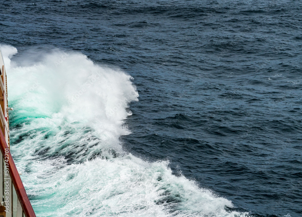 Bow of cruise ship in heavy seas and swell with waves crashing from the ...
