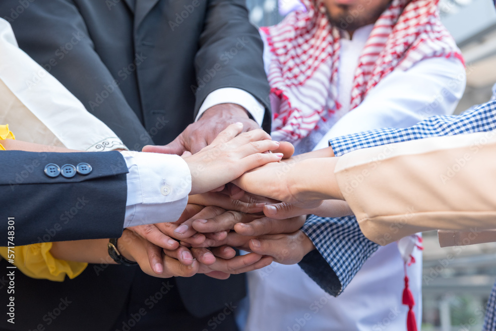 Persian and Arab business people join hands oneness. Unity and teamwork ...