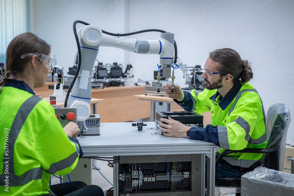 Engineer factory industry control automation welding robot arms machine ...