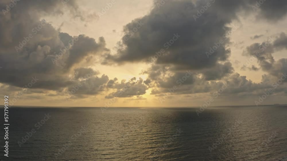 yellow sunrise dusk sky clouds flying over water aerial view at Cactus ...