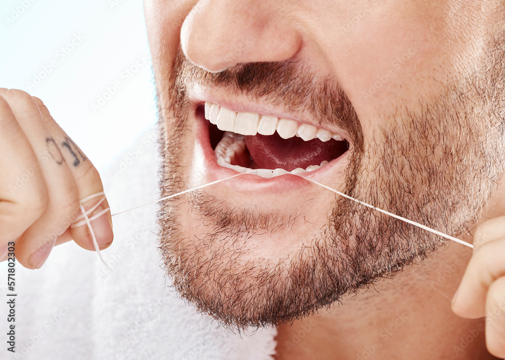 Dental, hygiene and man flossing his teeth in a studio for oral care ...
