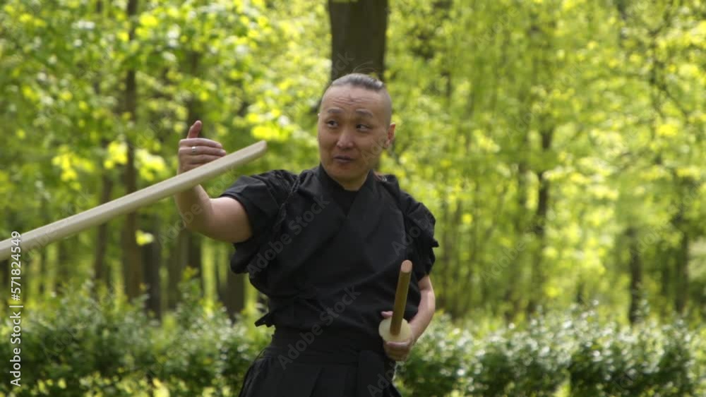 Japanese, black traditional kimano samurai, wars, touches sheath katana ...