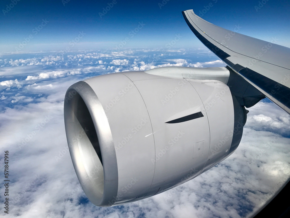Airliner Engine and wing in Flight Stock Photo | Adobe Stock