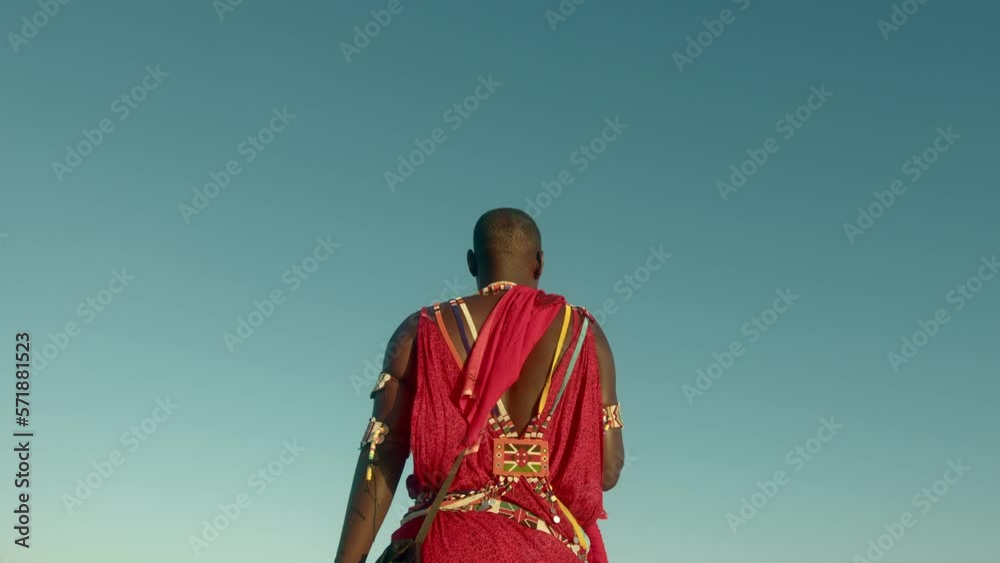 Back View Of An Indigenous Maasai Warrior In Red Traditional Clothes ...
