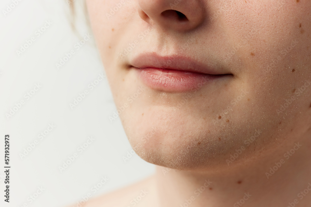 Cropped image of male face with moles, lis, chin. Young model posing ...