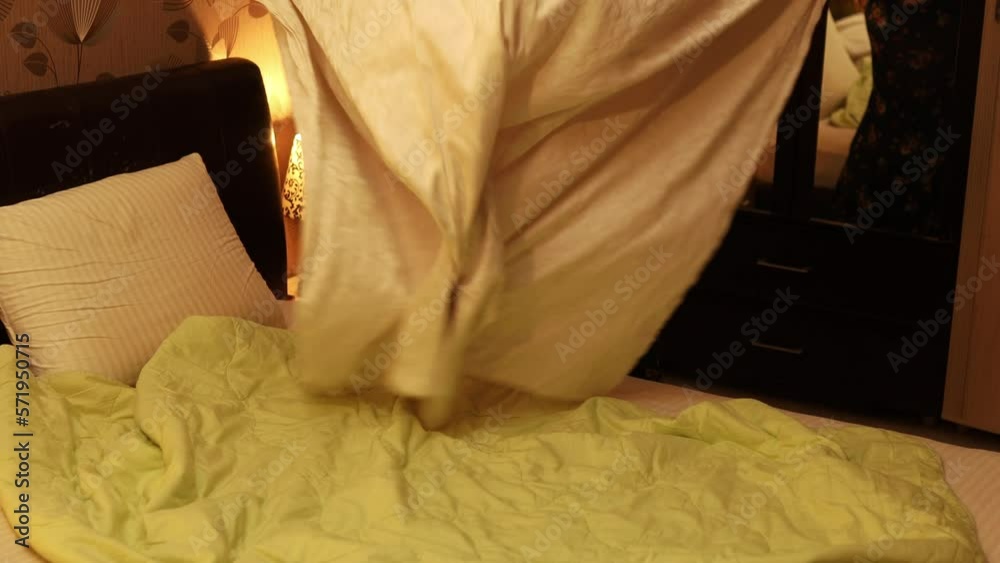 Portrait of focused plump middle-aged woman standing in bedroom at home ...