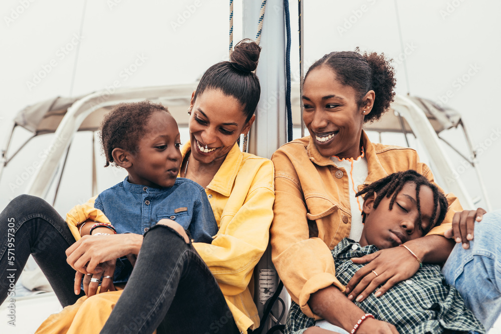Positive black people resting on yacht Stock Photo | Adobe Stock