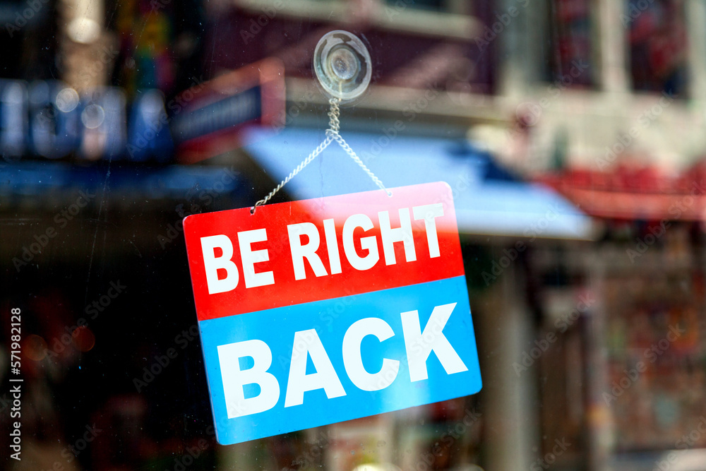 Be right back sign in a store window Stock Photo | Adobe Stock