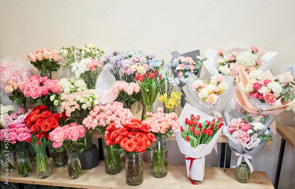 Flower shop concept. Different varieties fresh spring flowers in ...