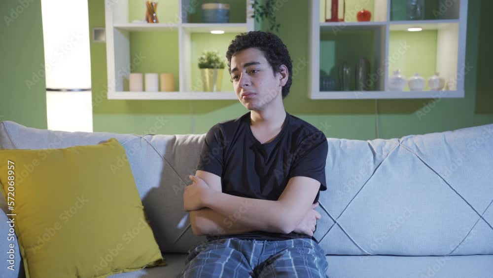 Boy crying and thinking about what happened to him, making unhappy ...