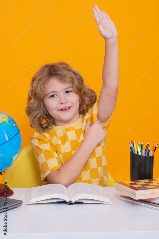 School child raising hands, willing to answer question. School child ...