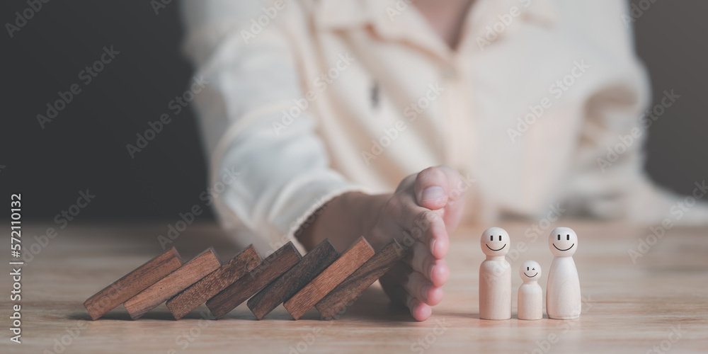 Human hands blocking wooden sticks,Financial risk management and ...