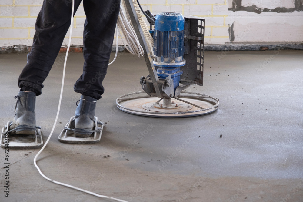 Ramming and grinding of semi-dry floor screed by a machine with a ...