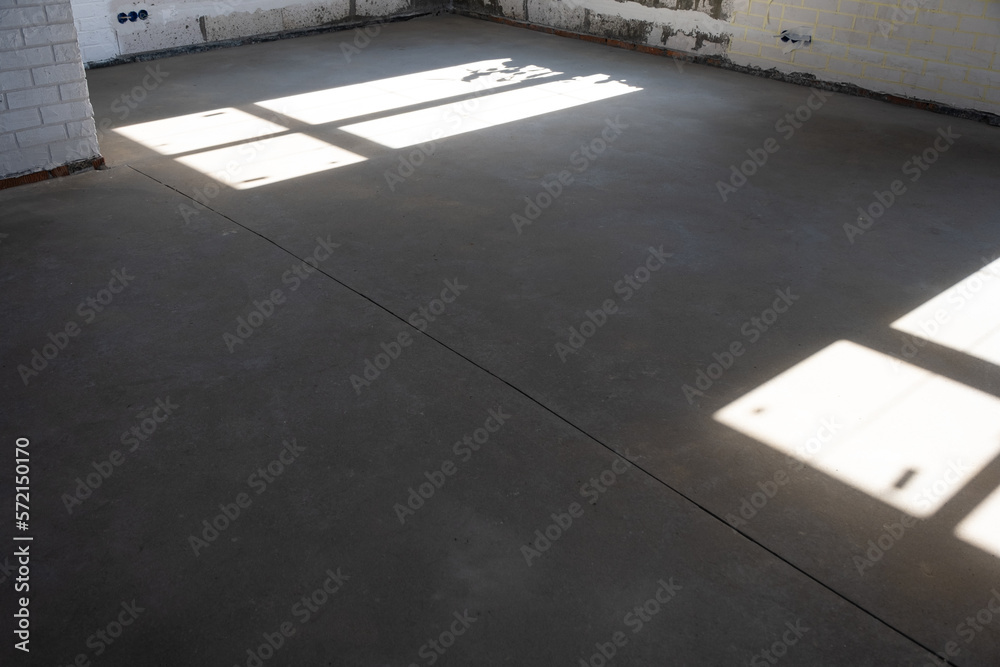 The leveled rough floor in a house under construction with a semi-dry ...