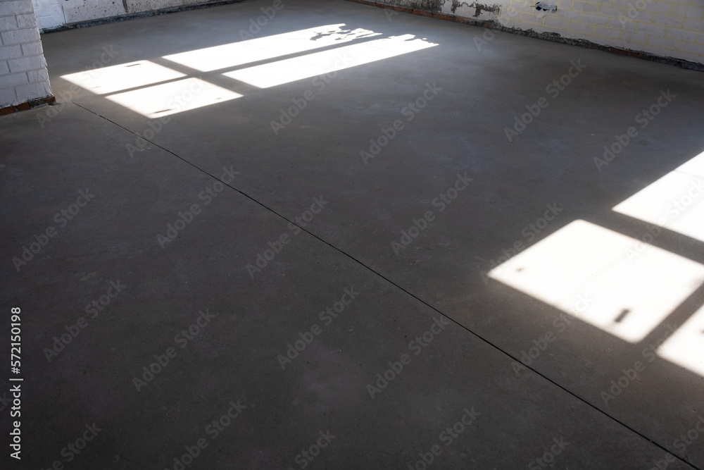 The leveled rough floor in a house under construction with a semi-dry ...