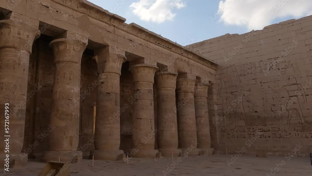 Pillars and wall relief of Mut, Amun-Ra and Ramses III at mortuary ...