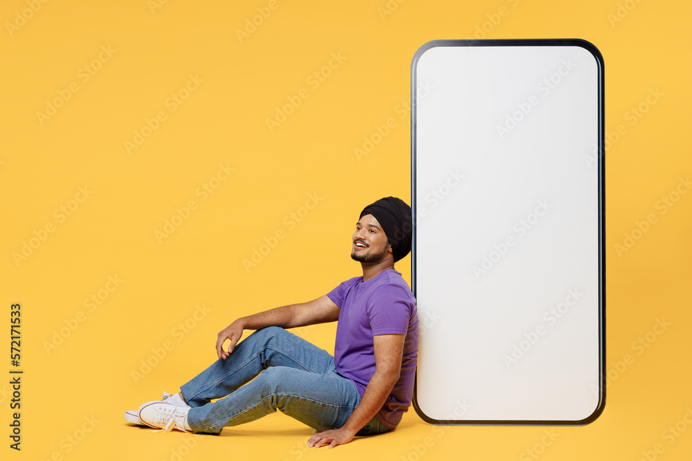 Full body fun devotee Sikh Indian man ties his traditional turban ...