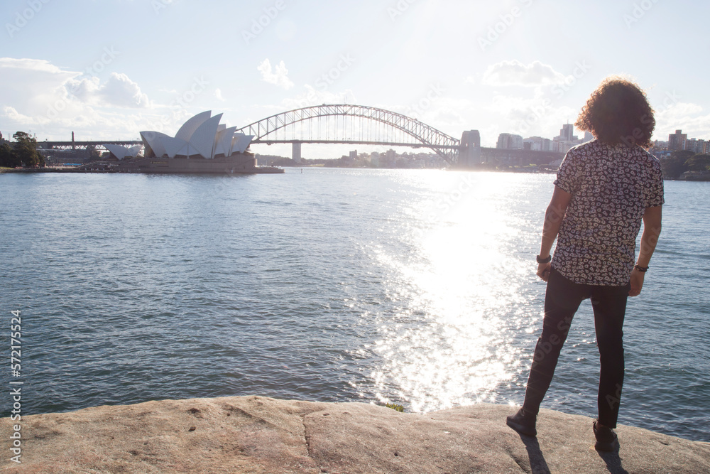 One man during golden hour, staring at the Sydney Opera House Stock ...