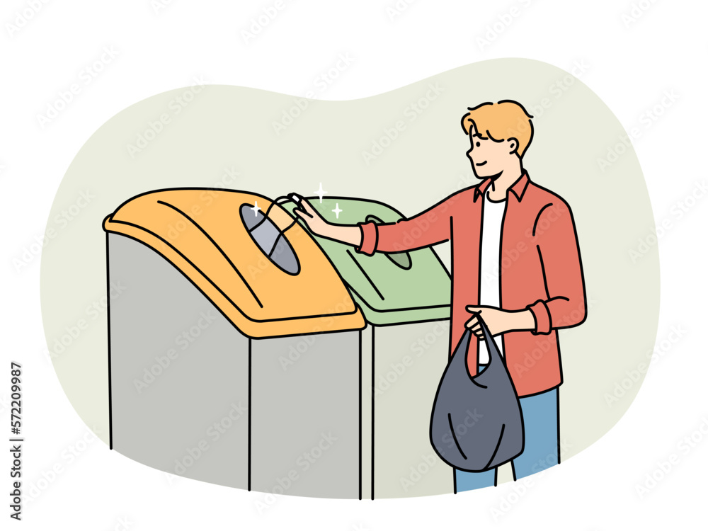 Man sorting garbage. Guy stand near bins sort trash and plastic in ...