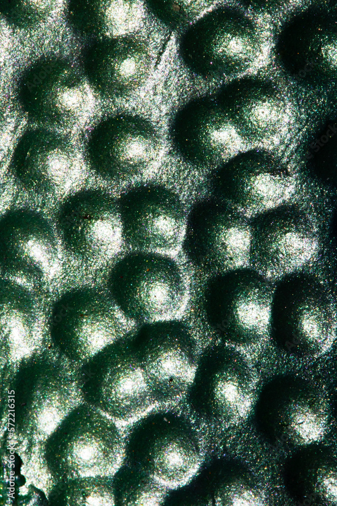 Alien trypophobia holes in a shiny sci-fi close up background Stock ...