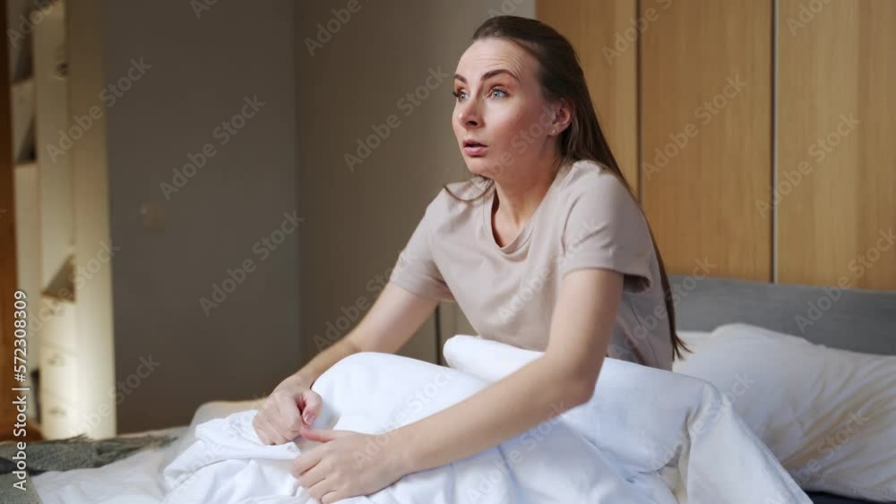 A shocked woman who overslept with her mouth open from screaming. A ...