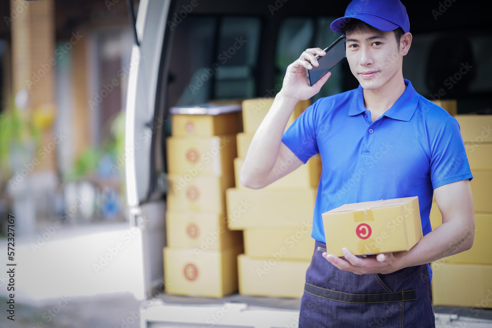 Deliver service. Man With Box in Car Outdoors Delivery Man in uniform ...