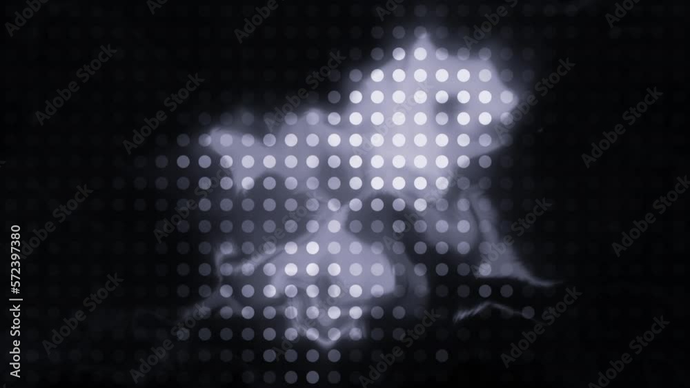 Dots and glowing spots on black background. Motion. Background with ...