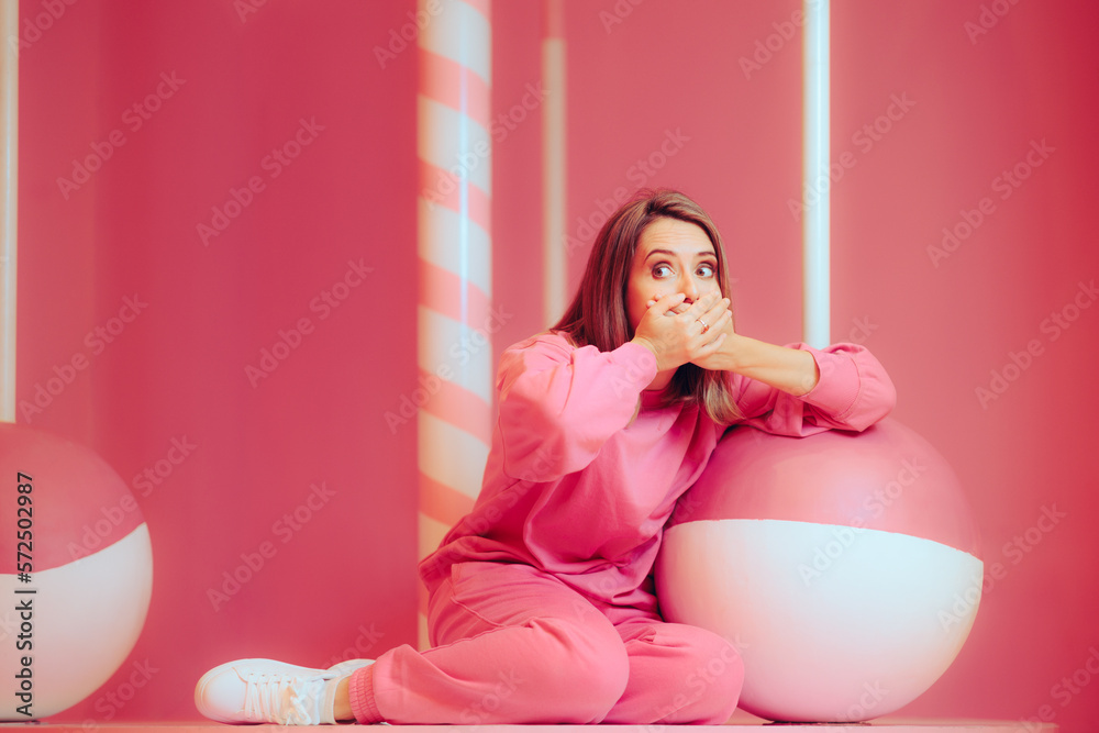 Woman Sitting next to Big Lollipop Feeling Sick from Sugar ...