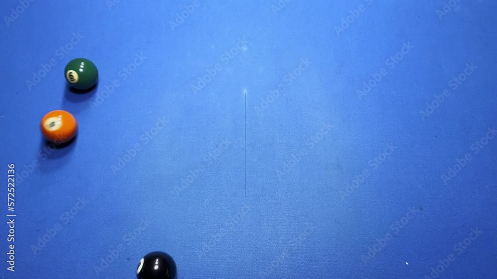 Pool balls in 8-ball starting position, cue ball hits and breaks the ...