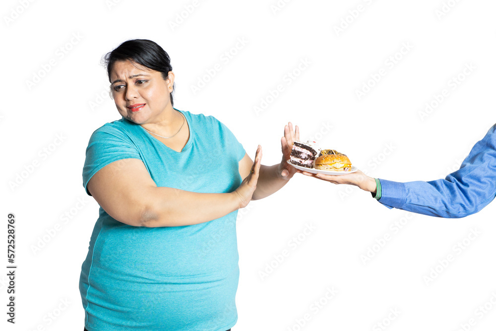 Overweight indian woman refuse and say no to junk food isolated over ...