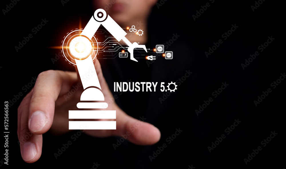 business man touching an automatic robotic arm with his finger ...