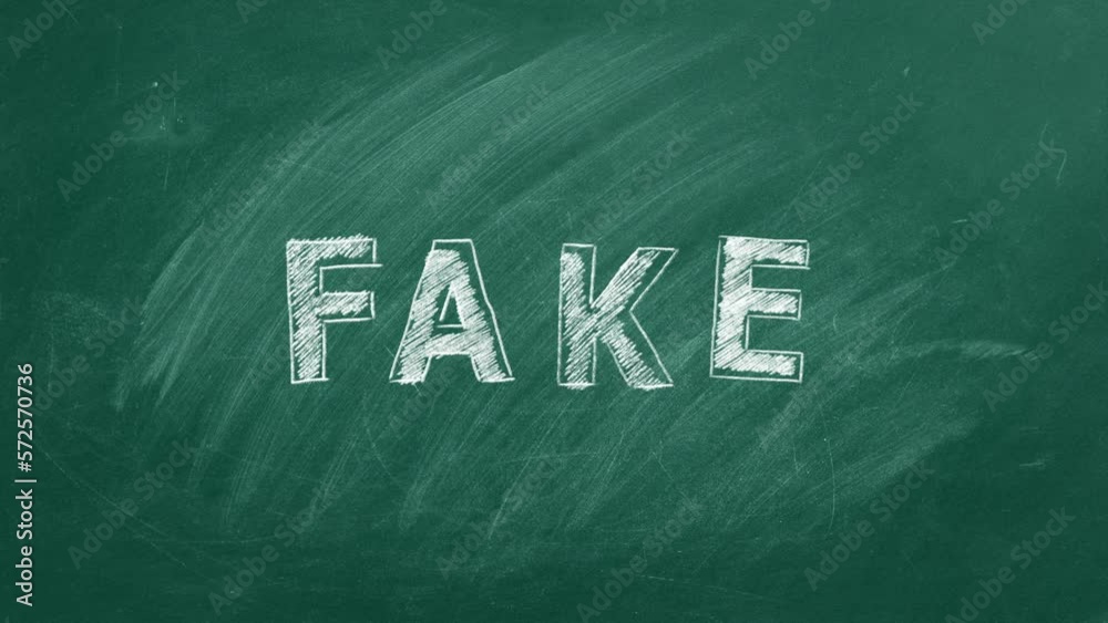 Stockvideon The word FAKE written in chalk on a greenboard. Information ...