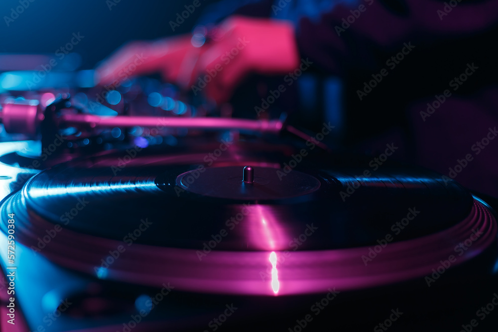 Club dj playing music on dance party. Background with disc jockey ...